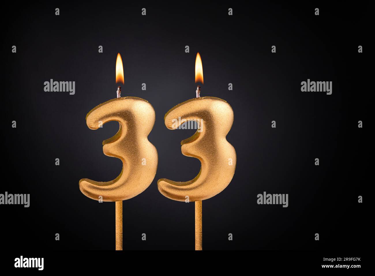 Golden candle 33 with flame - Birthday card on dark luxury background ...