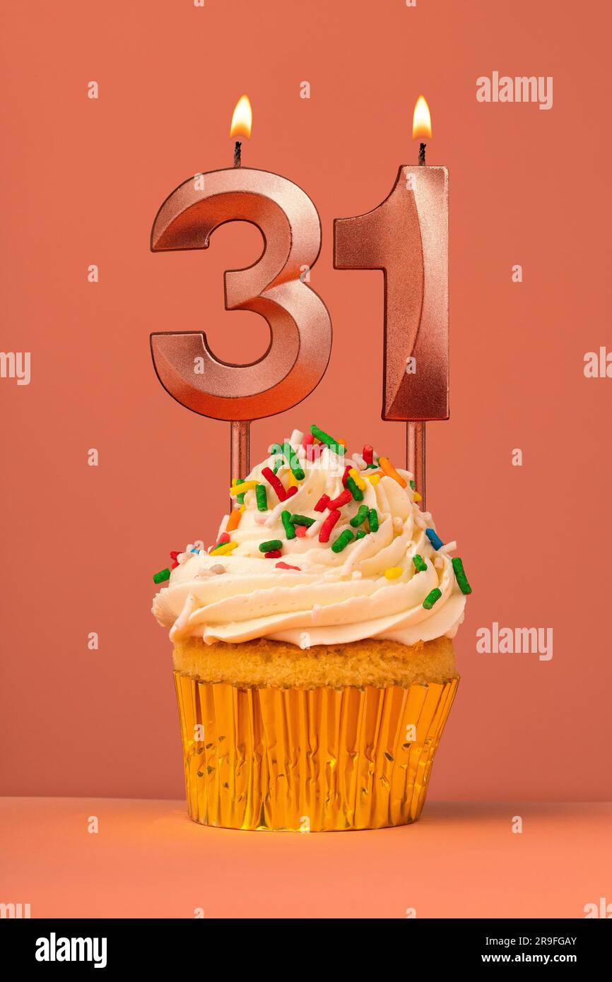 Birthday cake with candle number 31 - Coral fusion background Stock ...