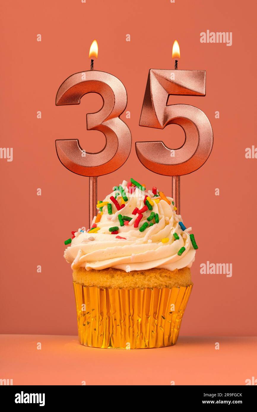 Birthday cake with candle number 35 - Coral fusion background Stock ...