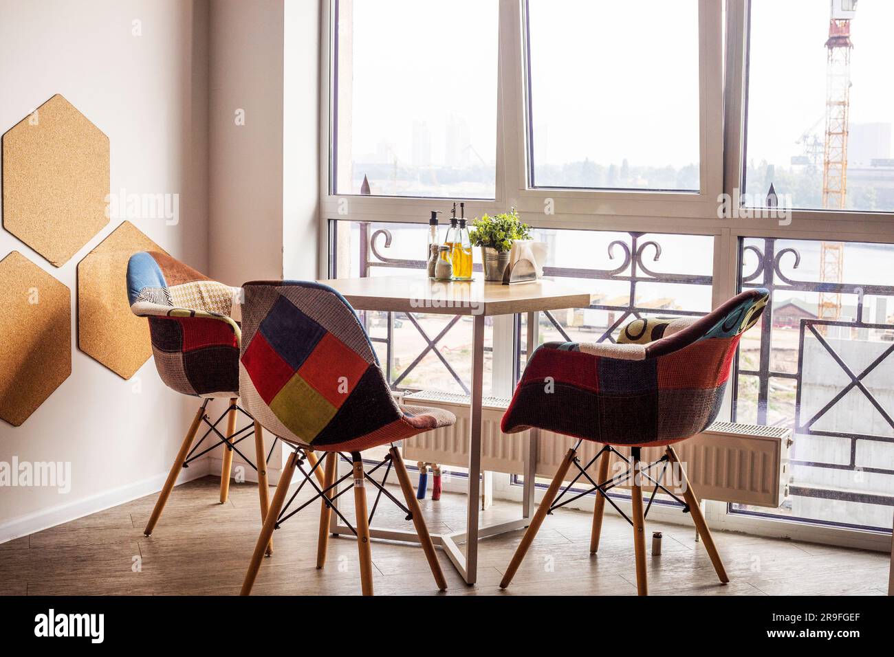table with chairs near window office modern interior. Snack area for ...