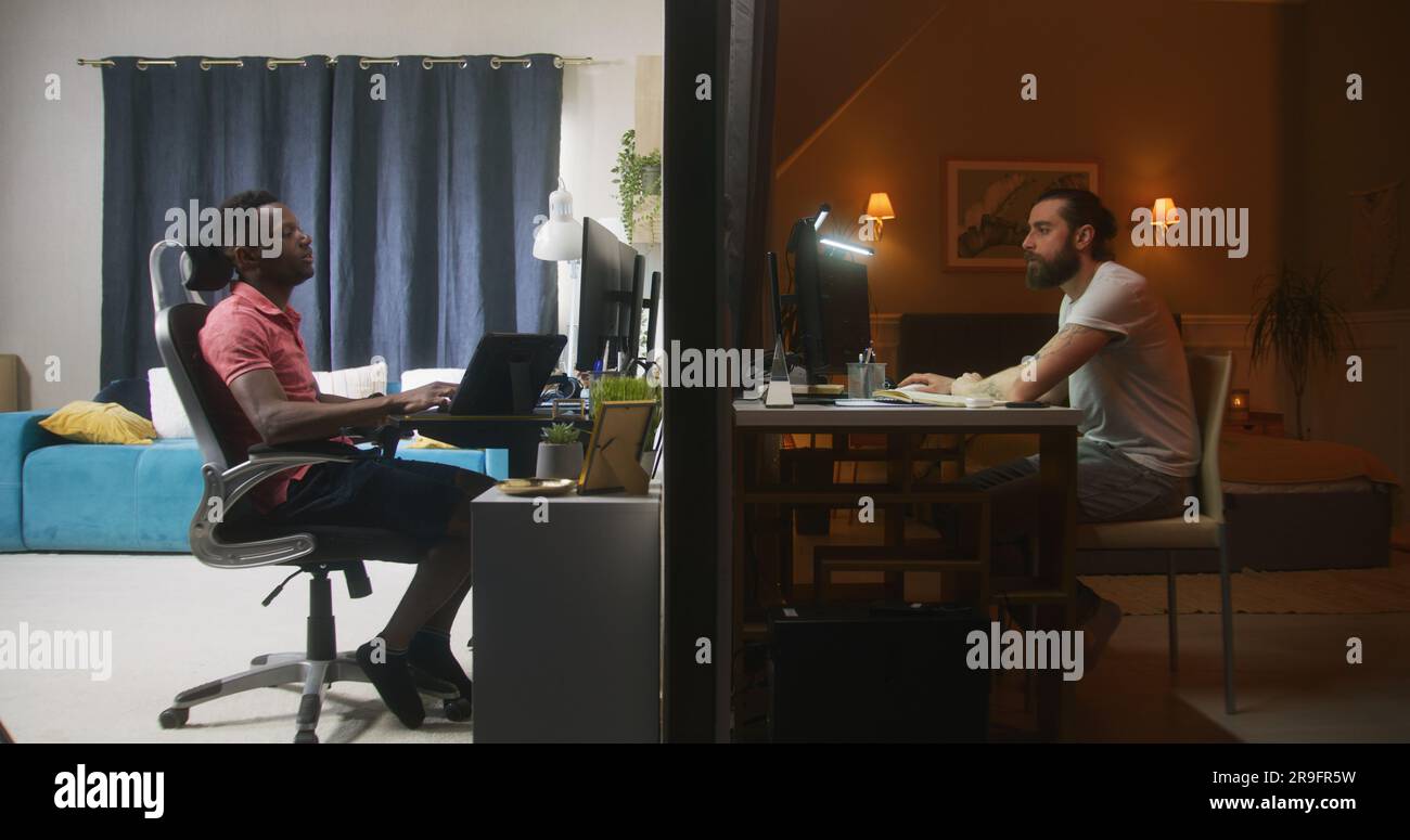 Two diverse neighbours sit computers hi-res stock photography and ...