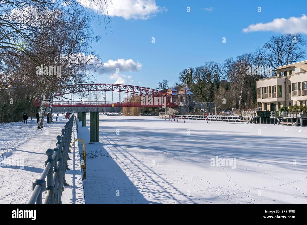 Berlin, Germany - February 12, 2021: Frozen stream Tegeler Fliess with ...