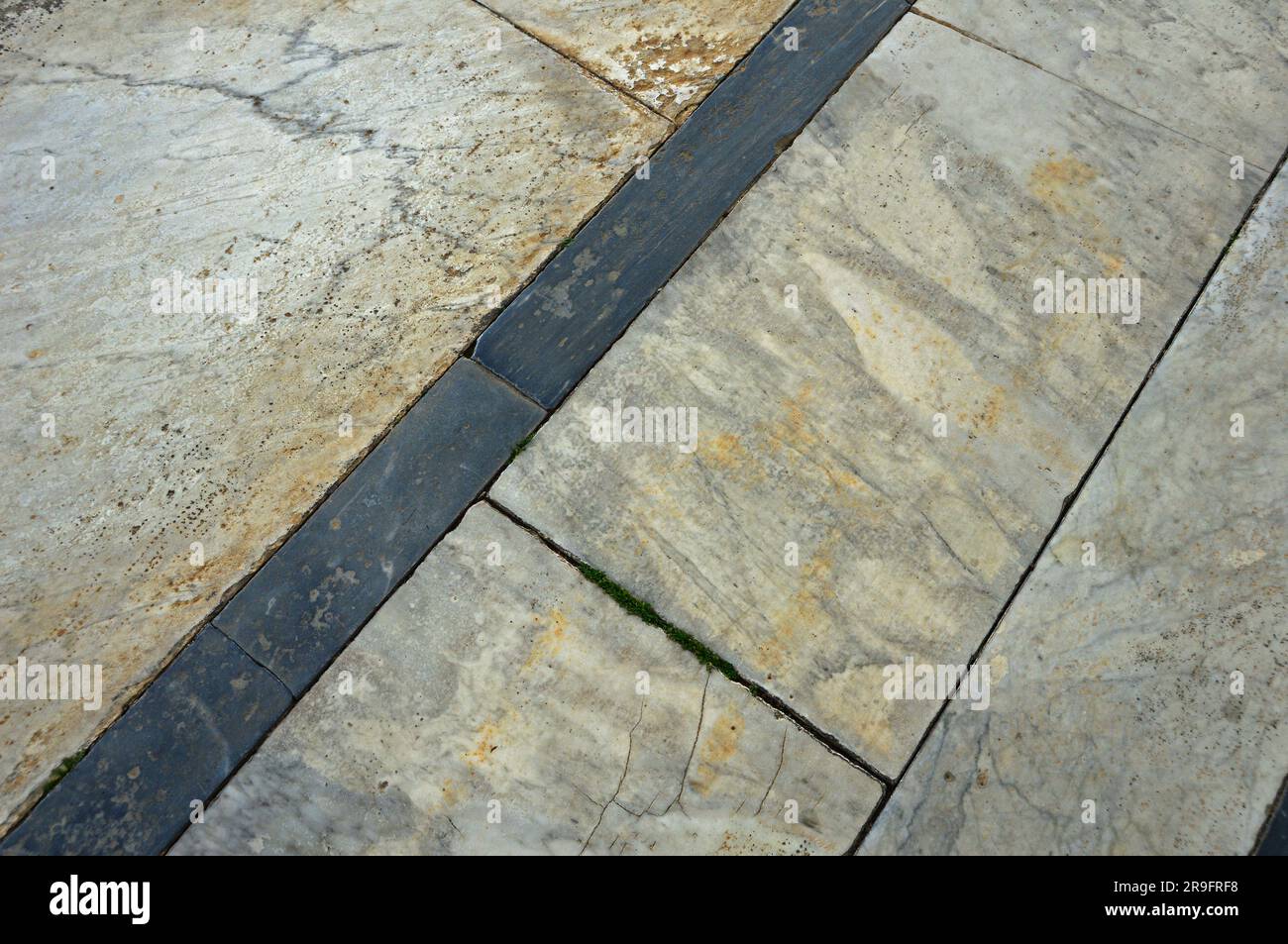 Pedestrian path made of marble tiles in square Miracoli in Pisa, Italy ...