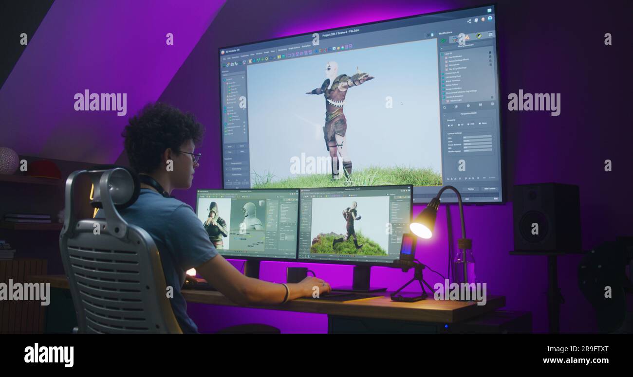 Young creative 3D designer creates video game character or animation ...