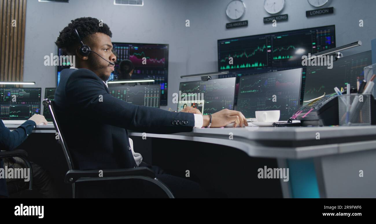 African american trader makes notes hi-res stock photography and images ...