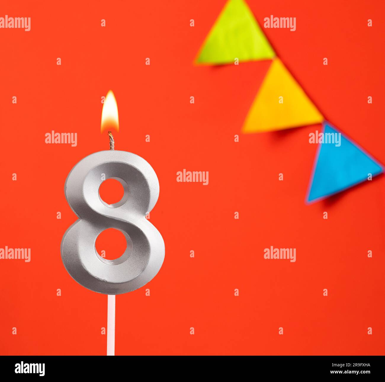 Birthday card - Number 8 candle in orange background Stock Photo - Alamy