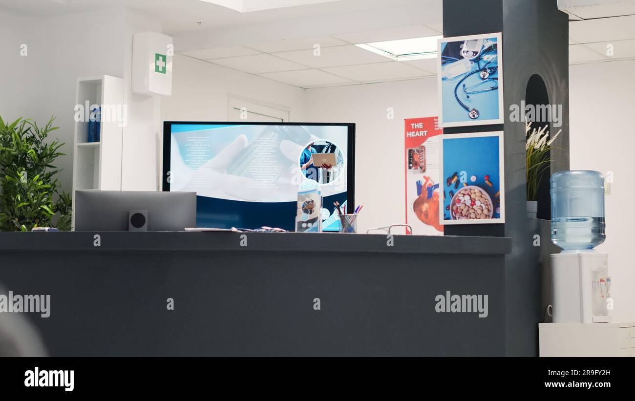 Empty front desk in medical clinic, facility reception counter with ...