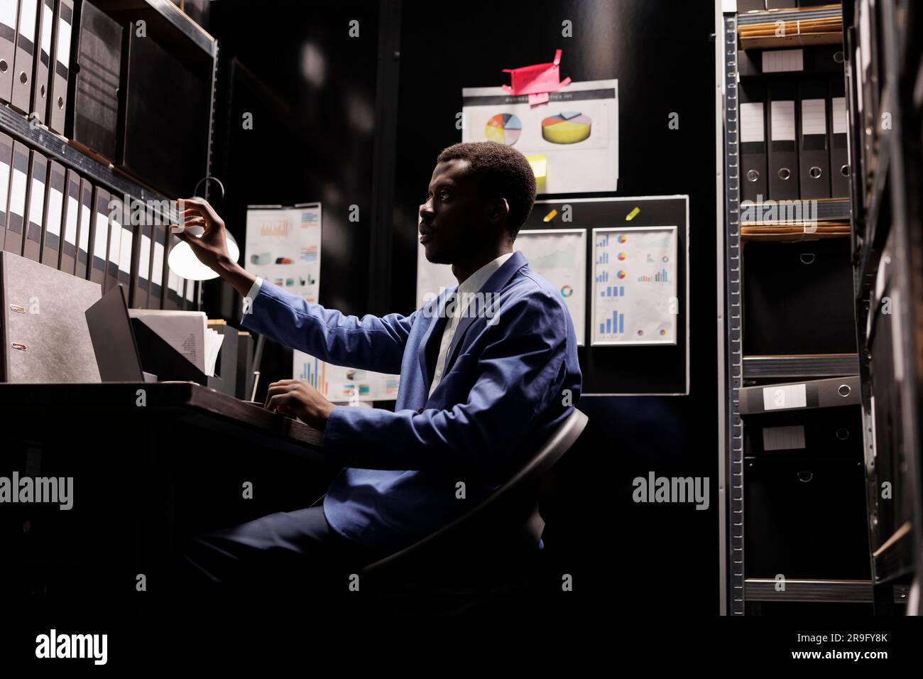 African american police officer using innovative technology to solve ...