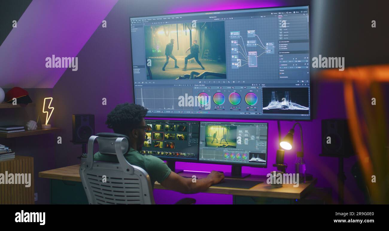 African American video maker edits action movie, makes color grading ...