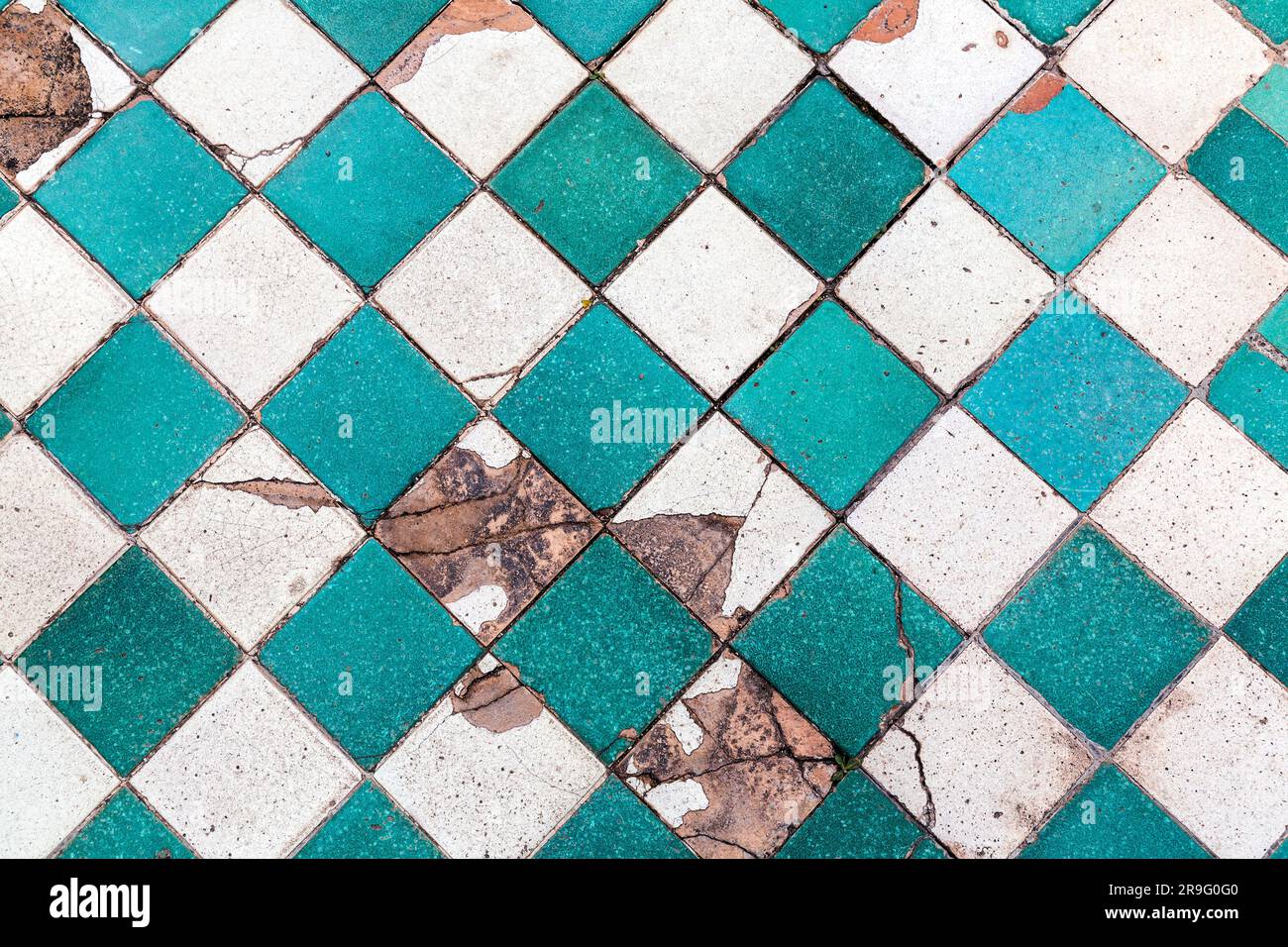 Fragment of Andalusian glazed ceramic tiled wall close up texture ...