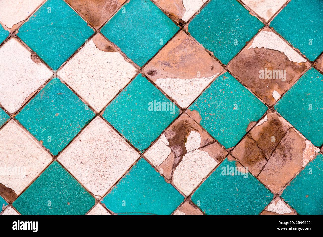 Fragment of Andalusian glazed ceramic tiled wall close up texture ...