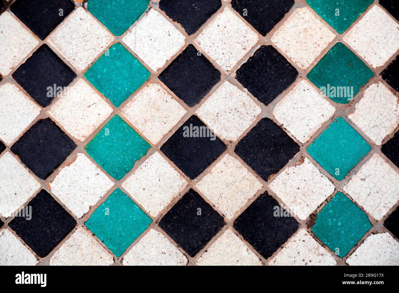 Fragment of Andalusian glazed ceramic tiled wall close up texture ...