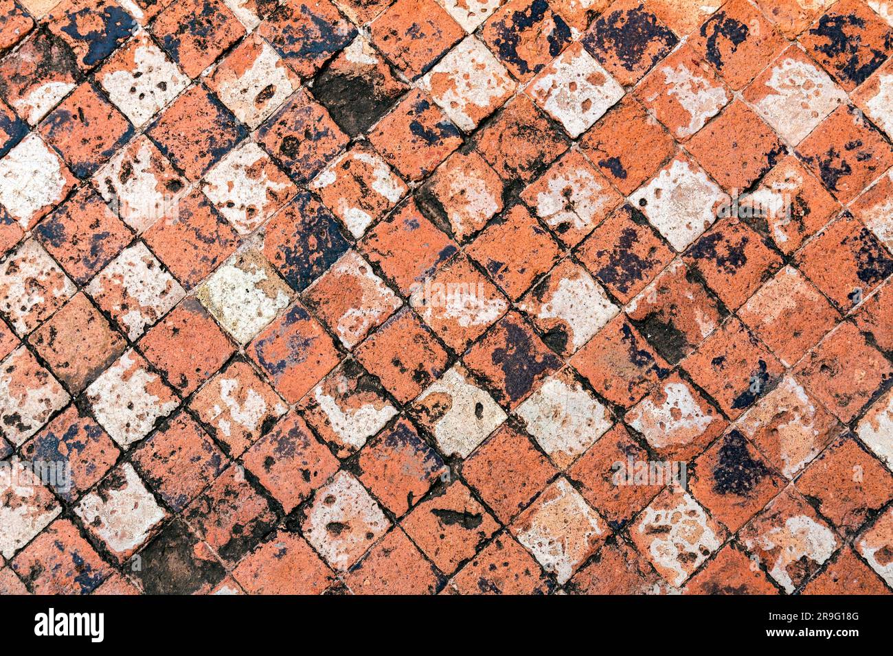 Fragment of Andalusian glazed ceramic tiled wall close up texture ...