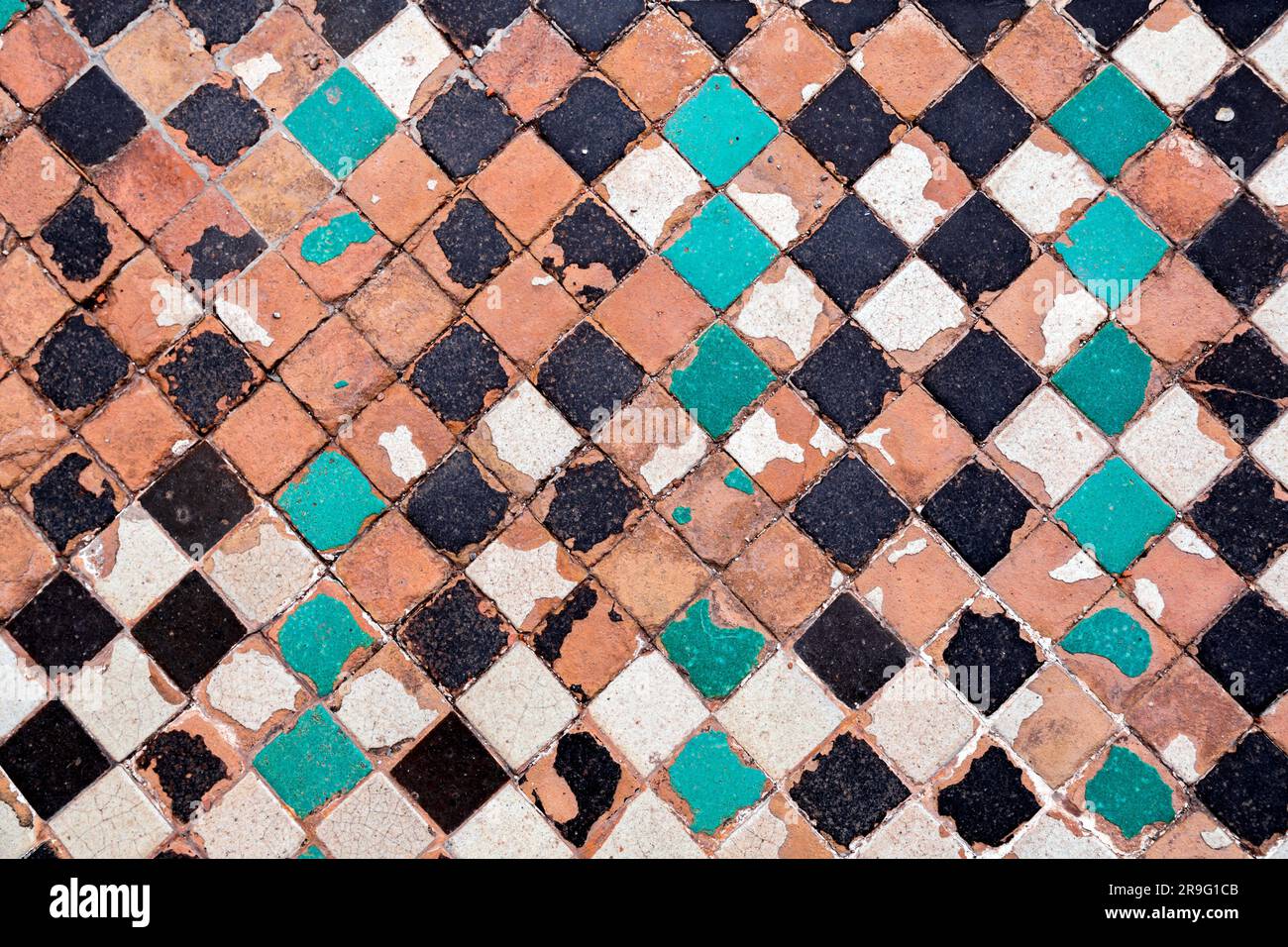 Fragment of Andalusian glazed ceramic tiled wall close up texture ...