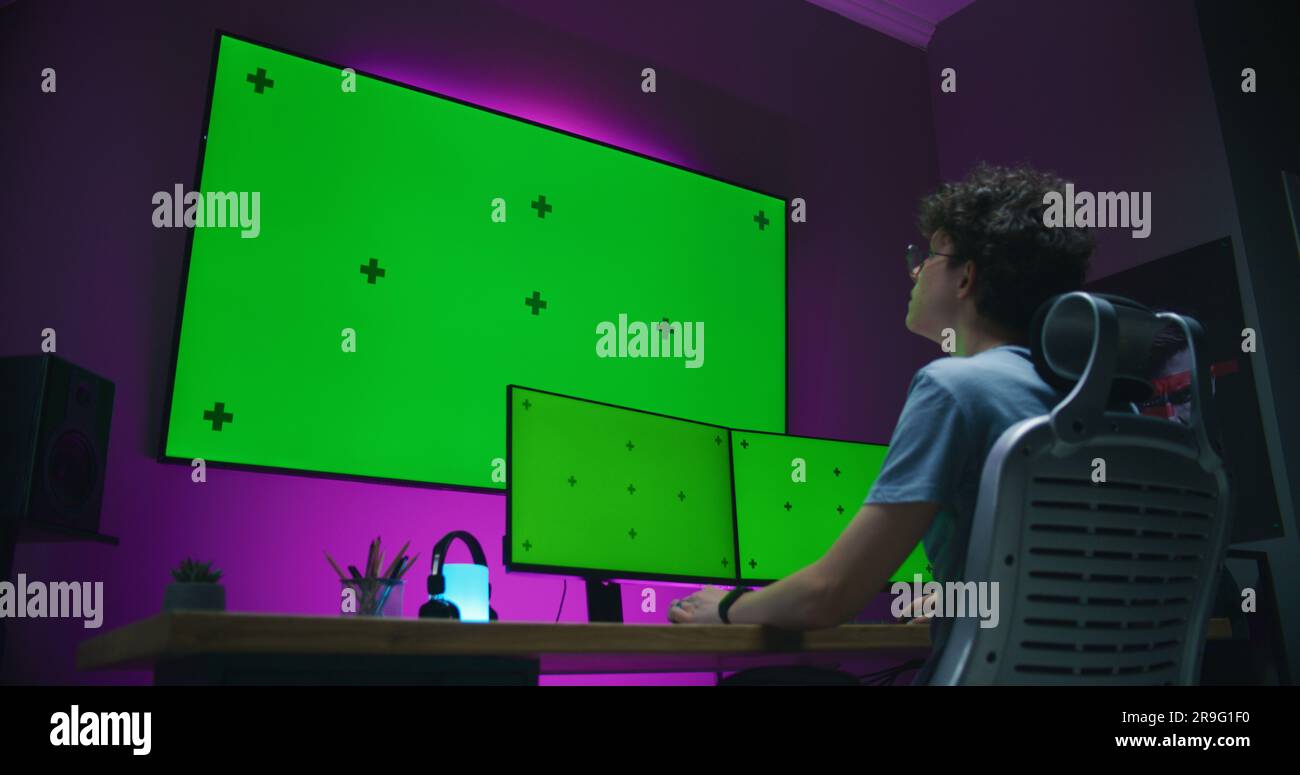 Young editor, 3D designer works remotely at home studio, edits movie ... Young editor, 3D designer works remotely at home studio, edits movie ...