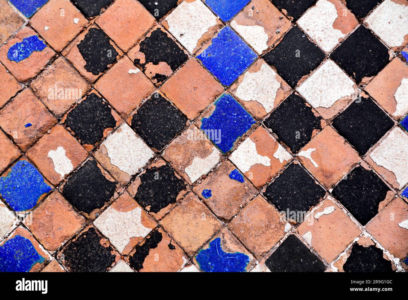 Fragment of Andalusian glazed ceramic tiled wall close up texture ...