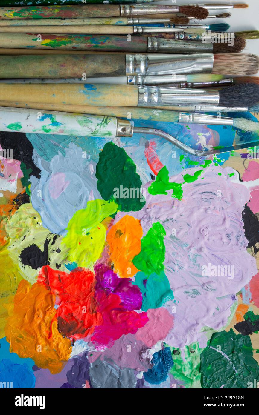 Artist's workshop, background from a palette and brushes for drawing ...