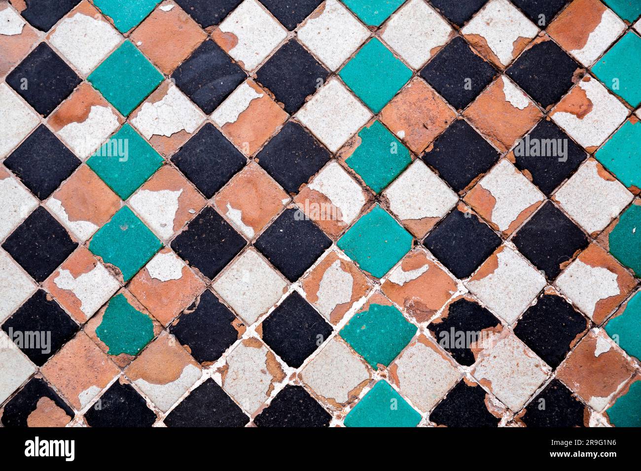 Fragment of Andalusian glazed ceramic tiled wall close up texture ...