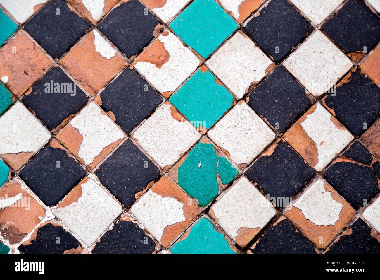 Fragment of Andalusian glazed ceramic tiled wall close up texture ...