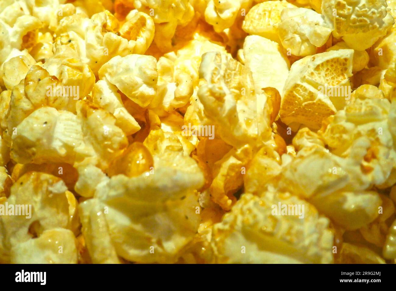 Close-up on a stack of butter caramel popcorn Stock Photo - Alamy