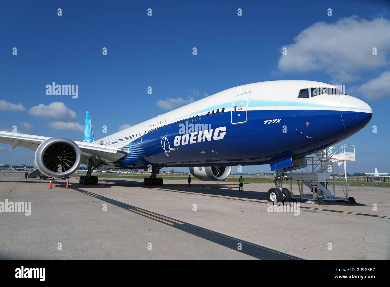 A Boeing 777-9, commercial jet sits on the tarmac during a layover at ...