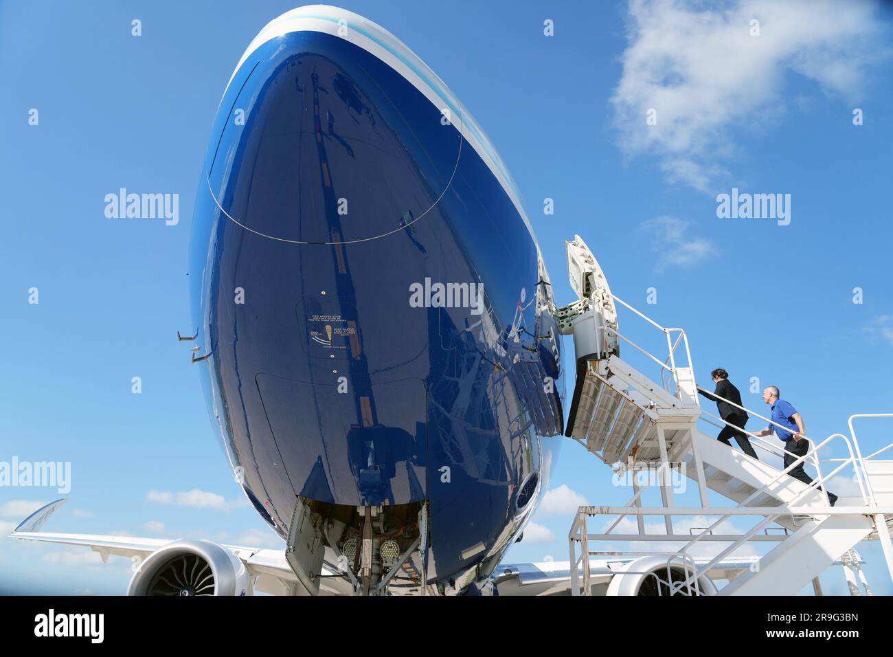 Boeing employees board a Boeing 777-9, commercial jet for a tour that ...