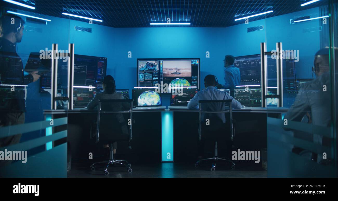 Team watch successful space rocket launch on big digital screens in ...