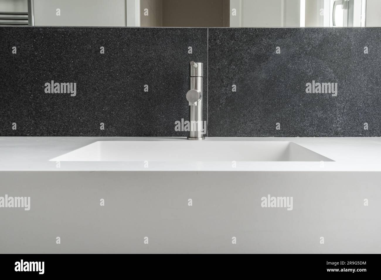 Frontal image of a contemporary sink with clean and straight lines in a ...