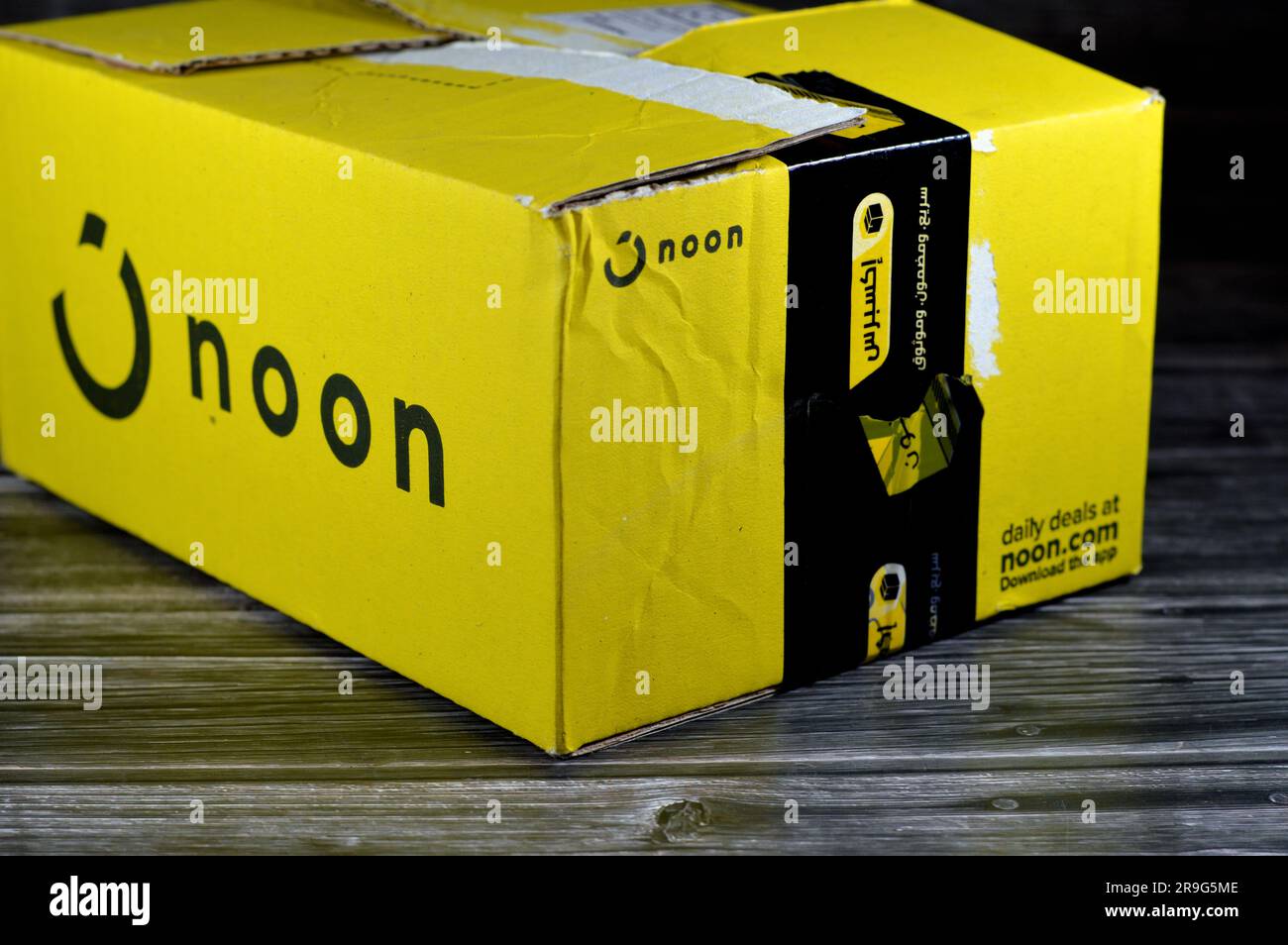 Cairo, Egypt, June 12 2023: Noon online shopping delivery yellow box ...