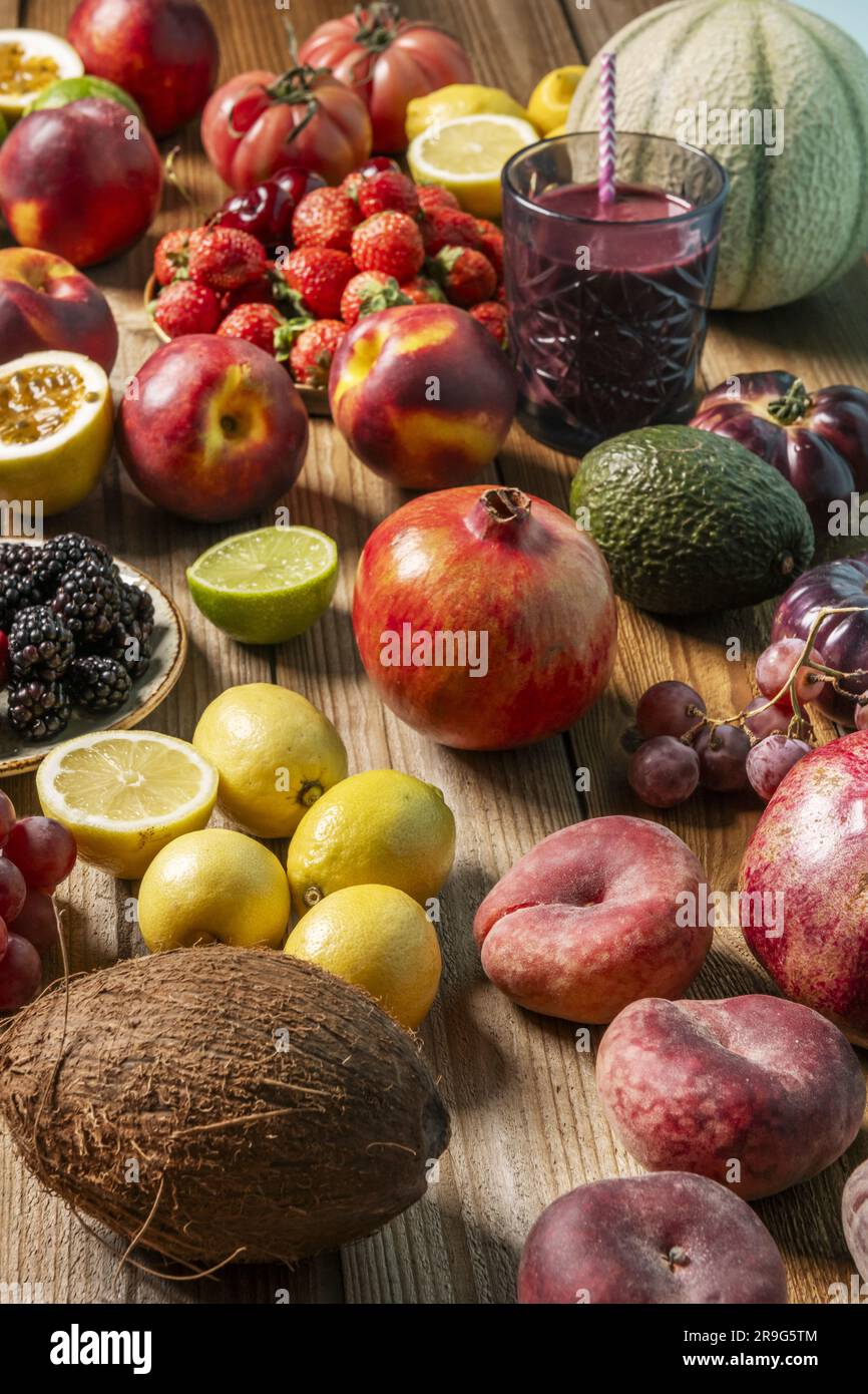 Delicious seasonal fruit still life with small lemons, a pomegranate ...
