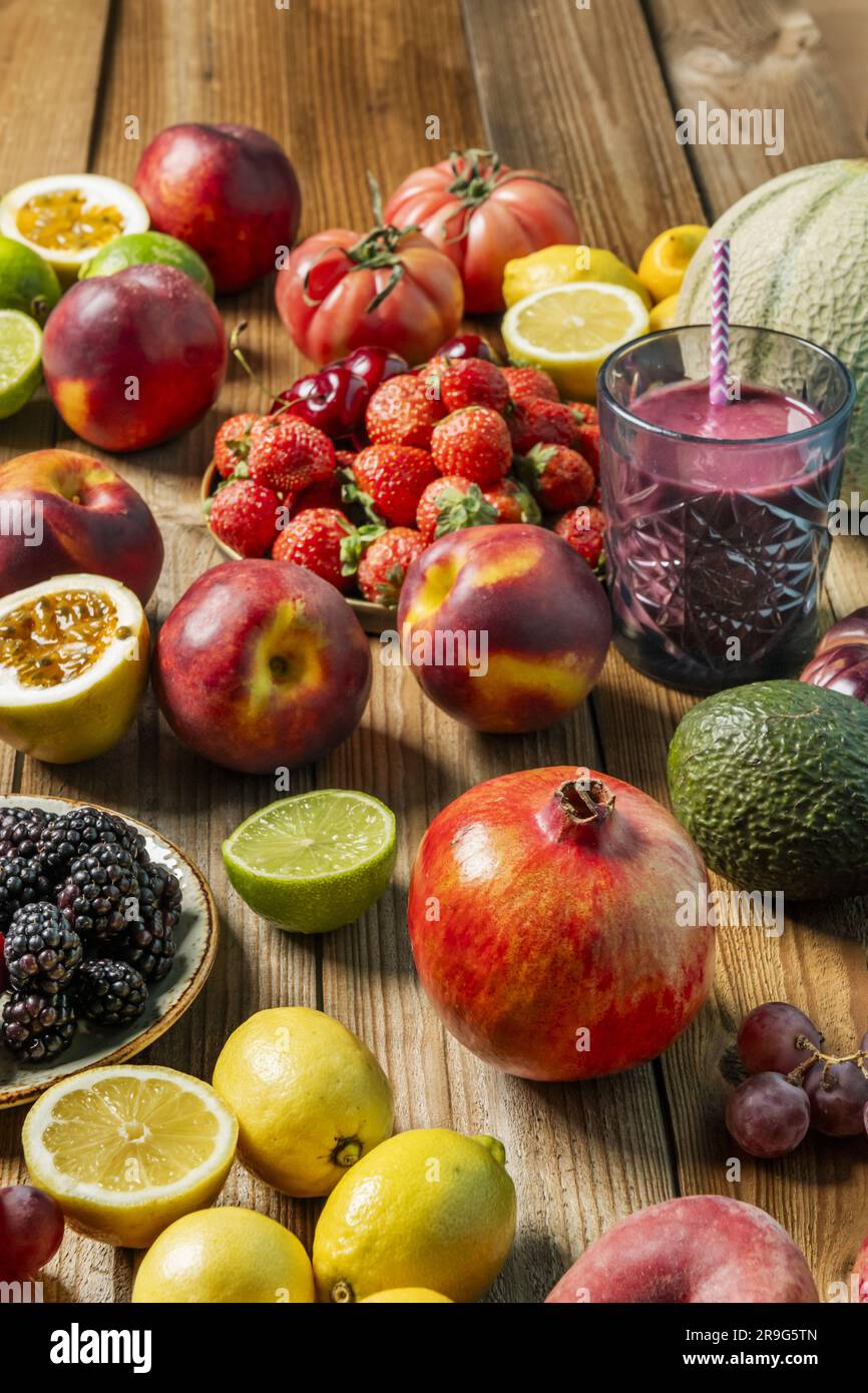 Delicious seasonal fruit still life with small lemons, a pomegranate ...