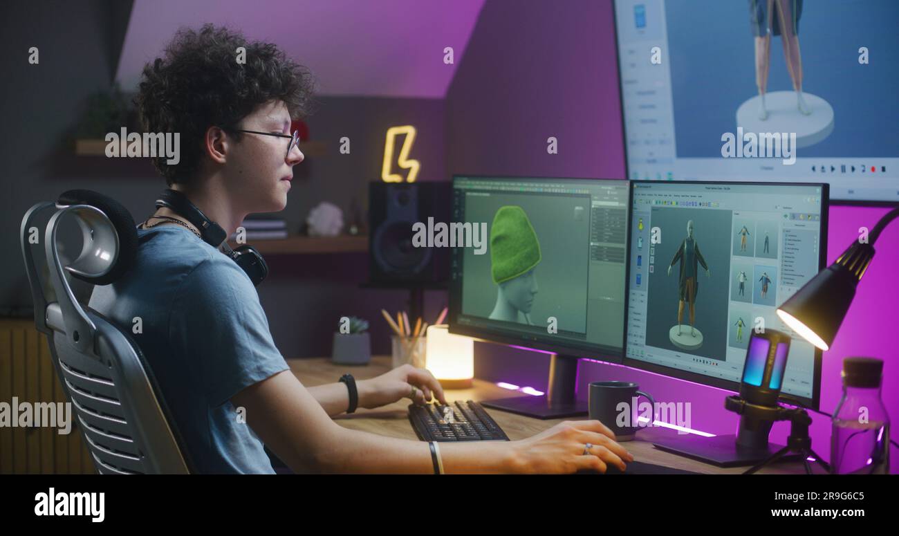 Young 3D designer creates video game character or clothes, works ...