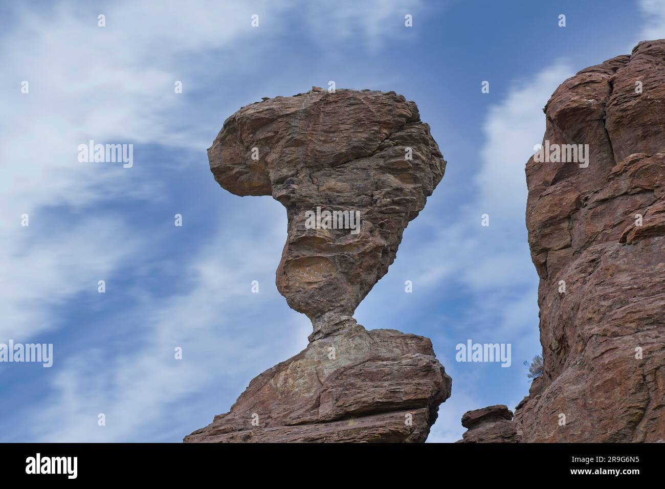 A clear photo of the famous balanced rock set against a partly cloudy ...