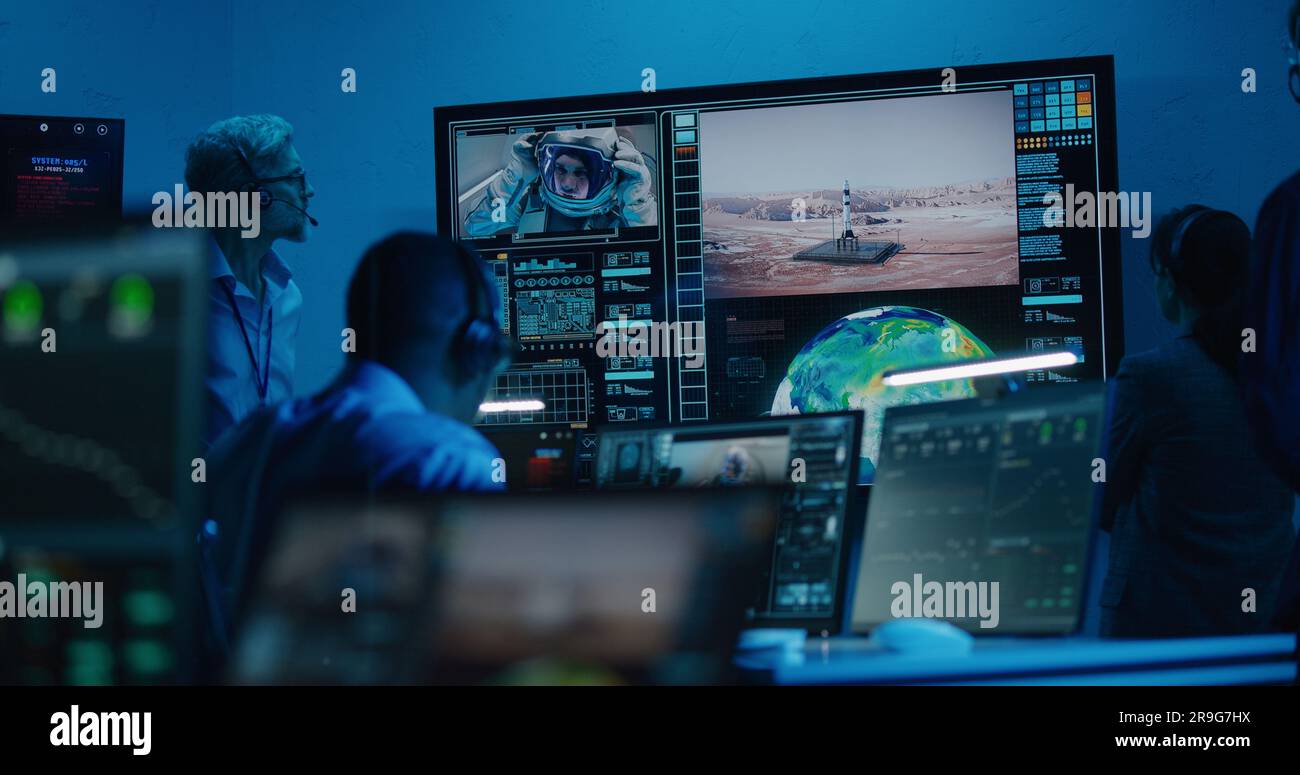 Flight Control Operators Monitor Space Mission On Computers In Command Center Have