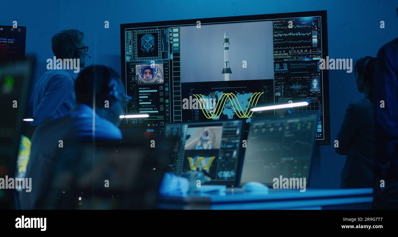Flight Control Operators Monitor Space Mission On Computers In Command Center Have