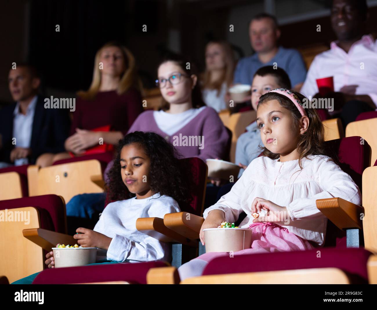 kids sitting at movie in auditorium in cinema Stock Photo - Alamy