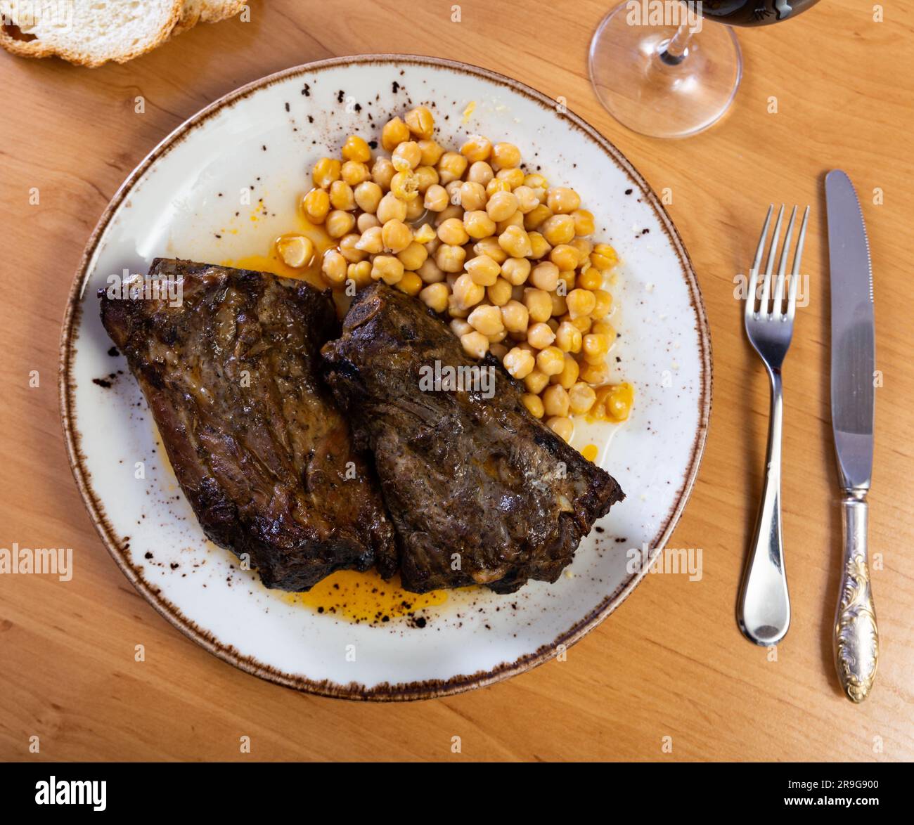 Juicy fat baked pork belly with portion of boiled steamed chickpeas ...