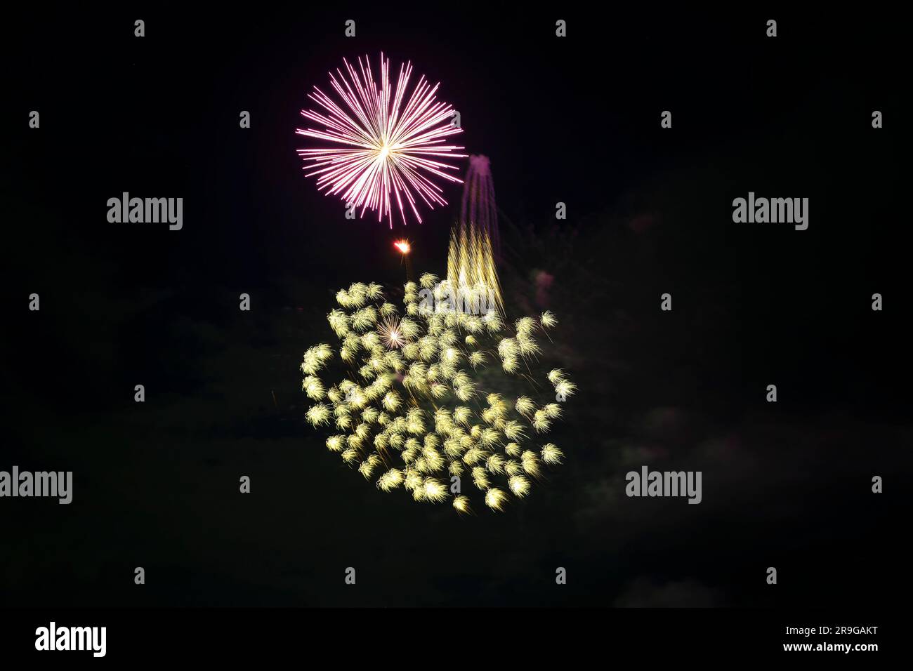 Aerial view of bright fireworks exploding with colorful lights against ...