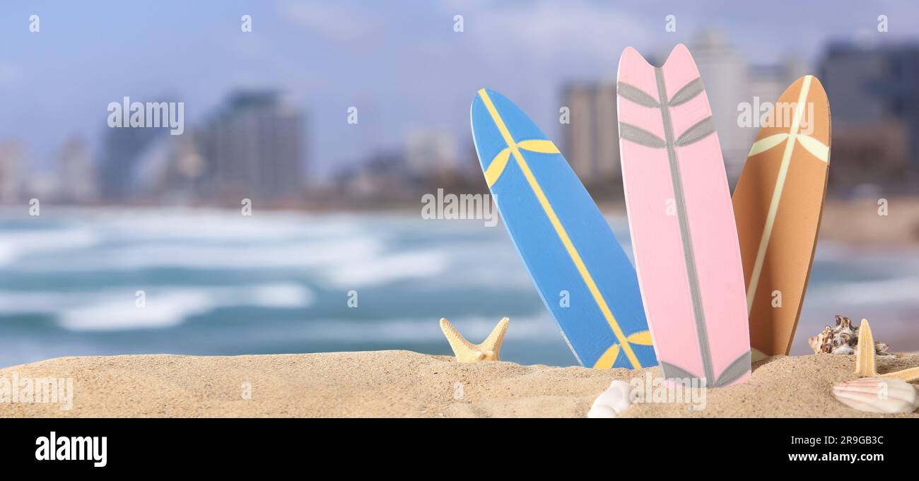 Small surfboards on beach sand Stock Photo - Alamy