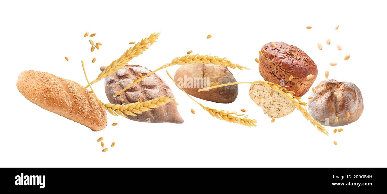 Flying fresh bread with spikelets and seeds on white background Stock ...