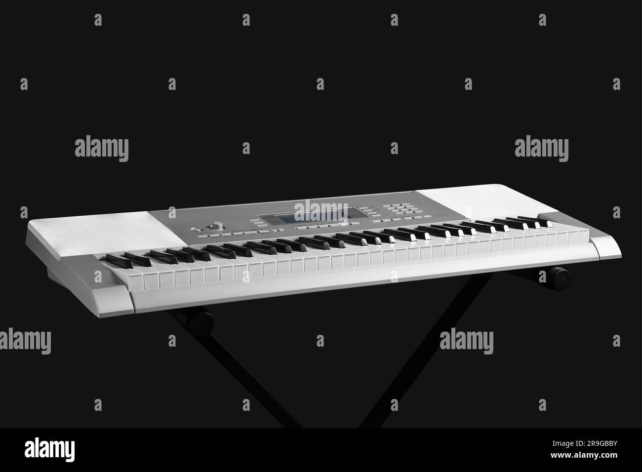 Modern synthesizer on black background Stock Photo - Alamy