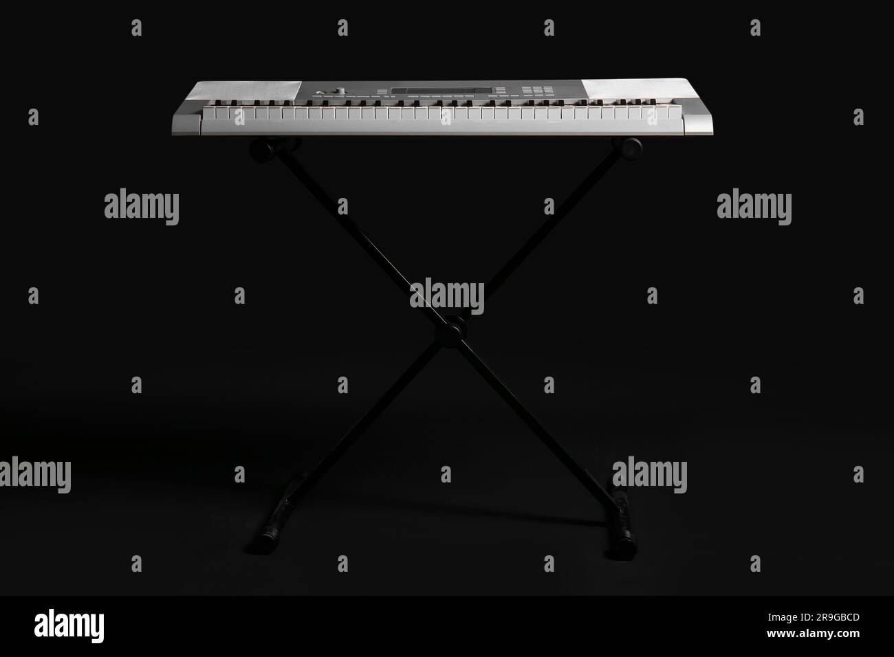 Modern synthesizer on black background Stock Photo - Alamy