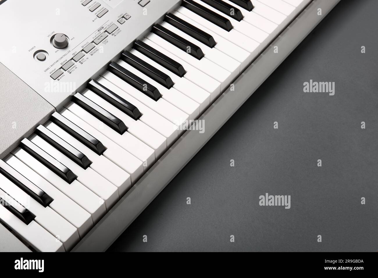 Modern synthesizer keyboard on black background Stock Photo - Alamy