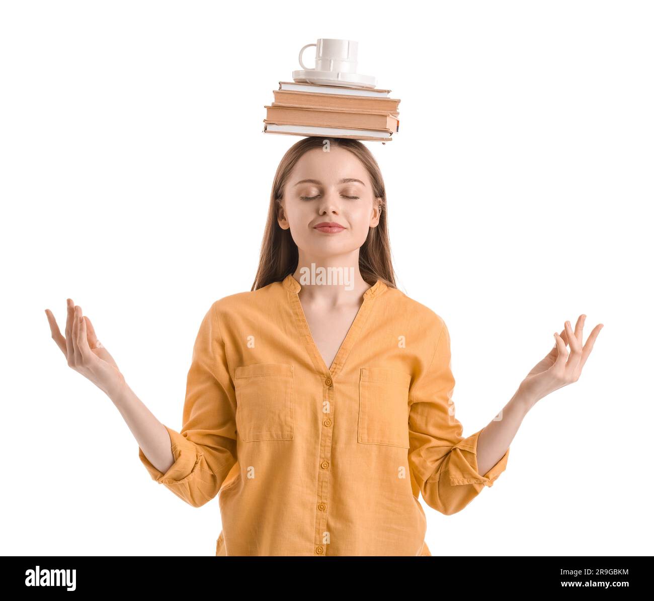 Woman balancing books head hi-res stock photography and images - Alamy