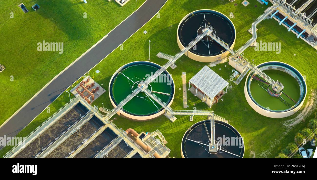Aerial view of modern water cleaning facility at urban wastewater treatment plant. Purification ...