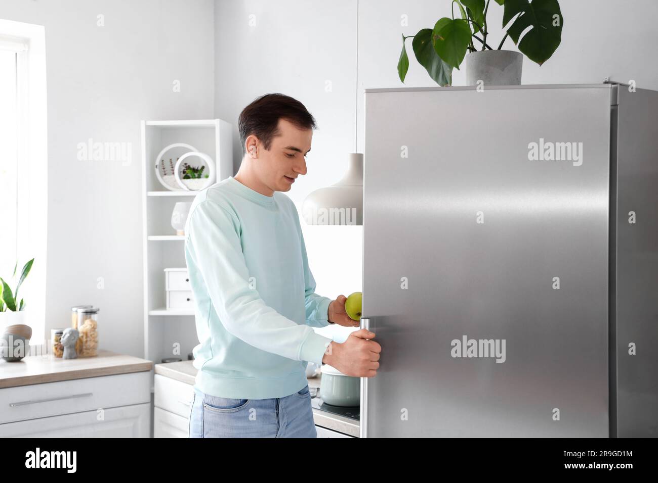 Man opening fridge hi-res stock photography and images - Alamy