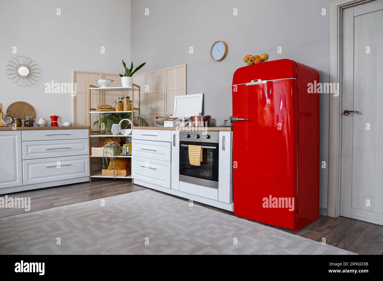 Interior of kitchen with red fridge, counters and shelving unit Stock ...