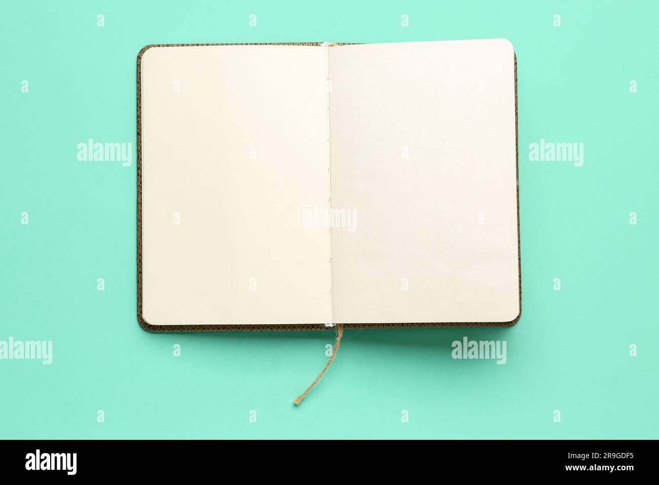 Blank open notebook on color background Stock Photo - Alamy