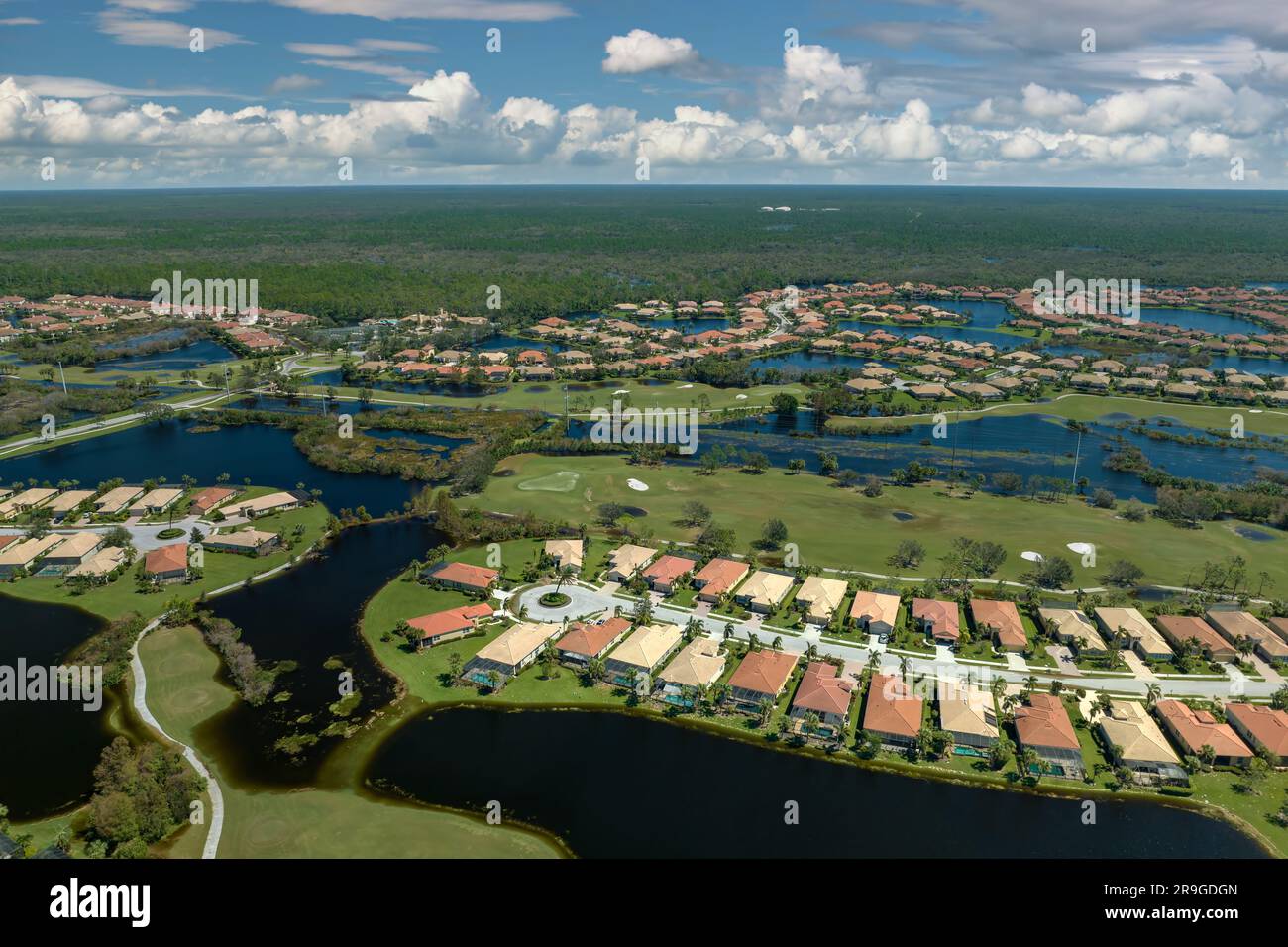 Aftermath of natural disaster. Flooded houses by hurricane Ian rainfall ...