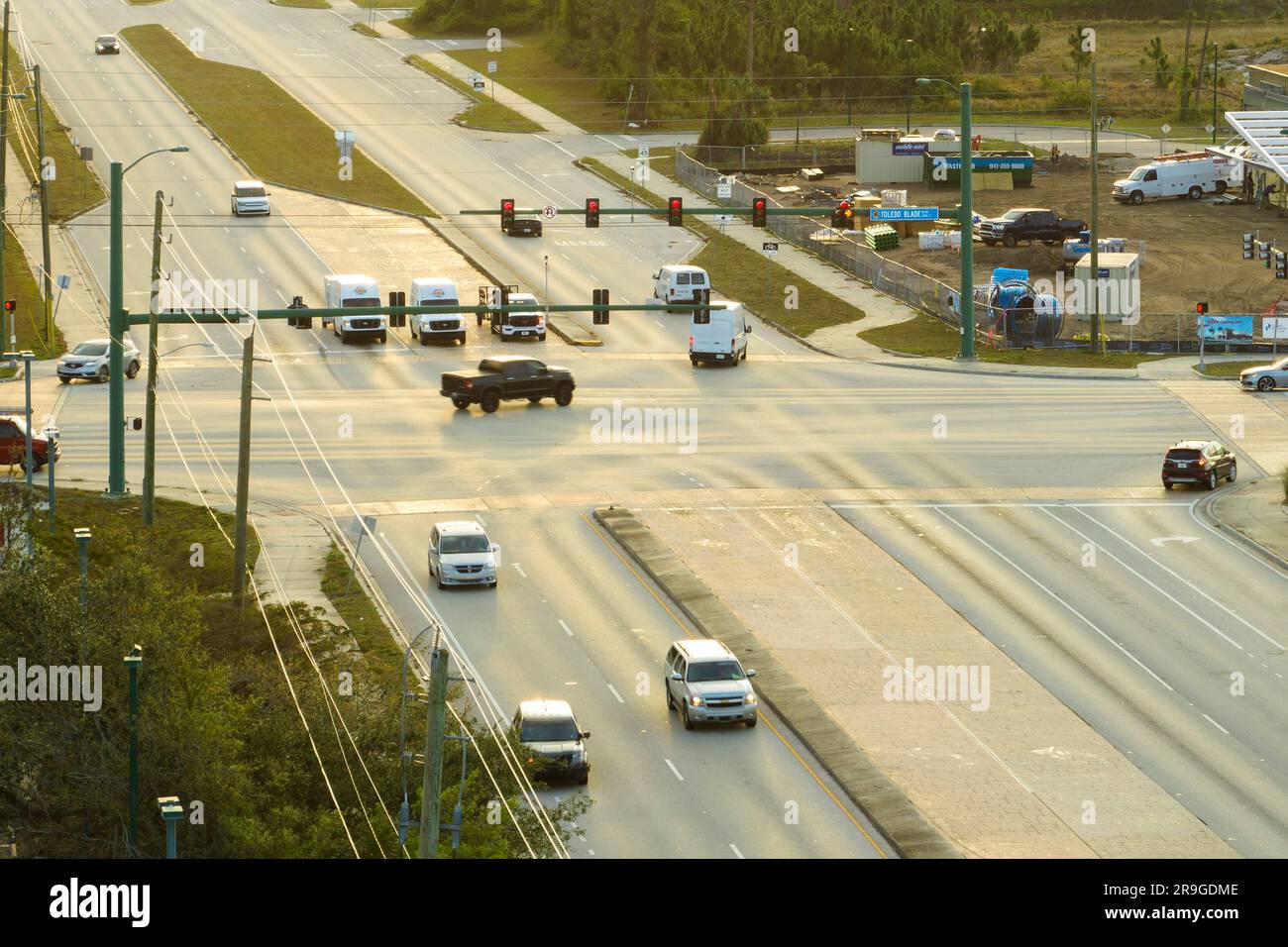 Aerial view of wide multilane road with moving cars at intersection ...